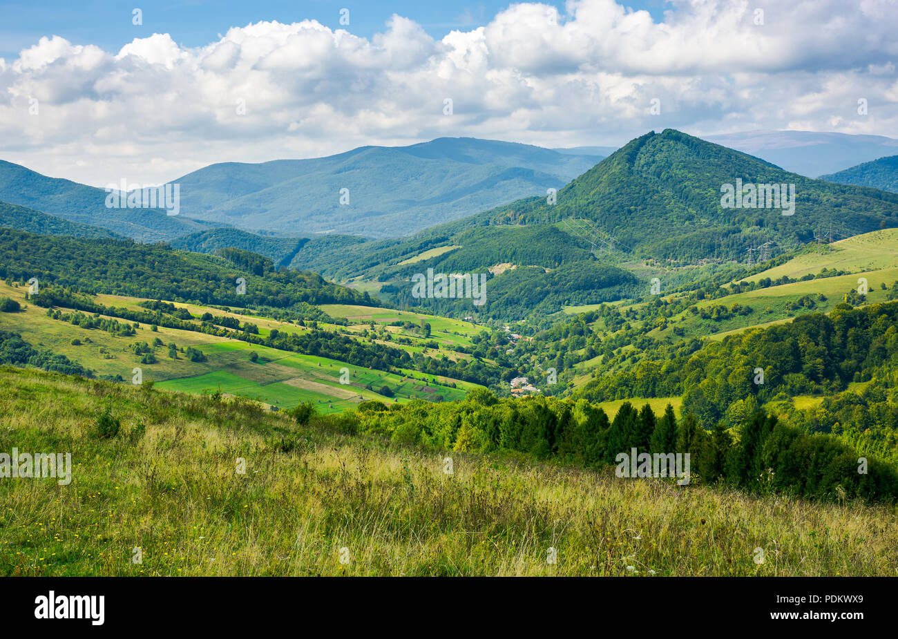 beautiful countryside in mountains. village in the valley and ...