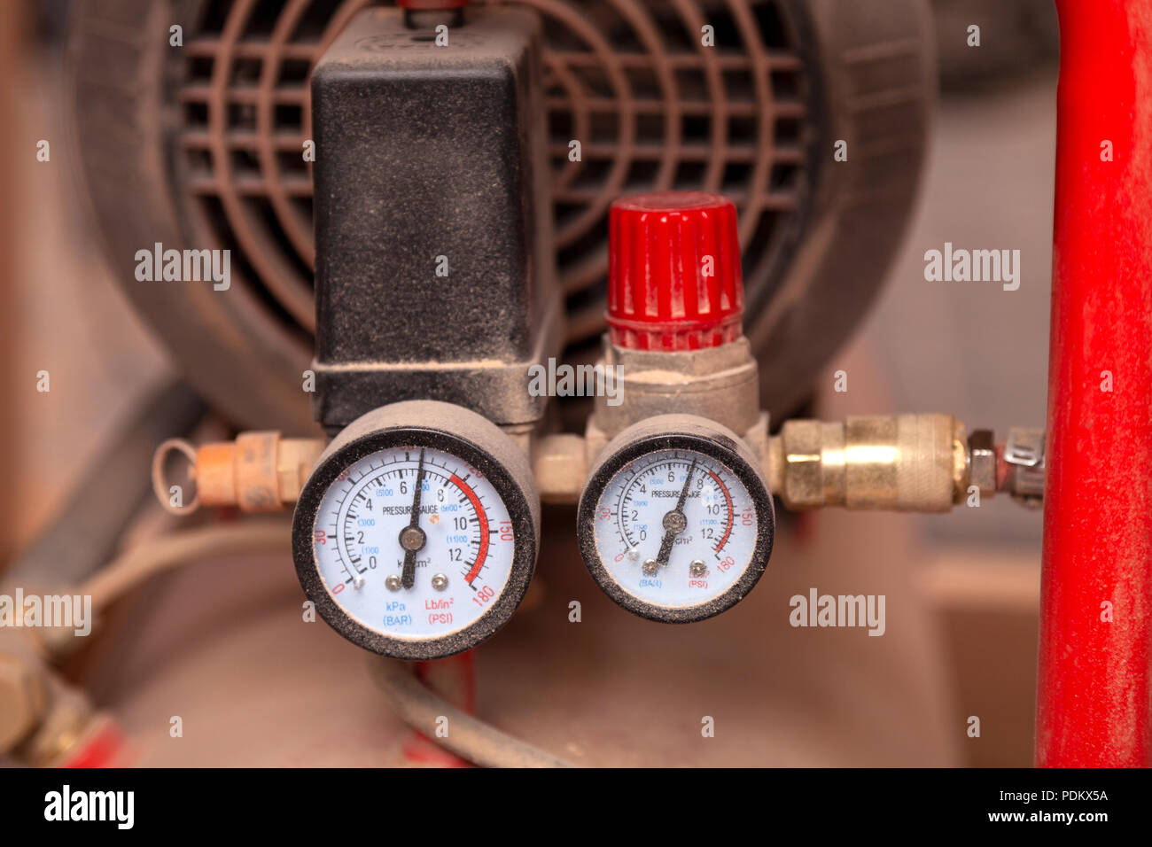 Close-up of a reducer and a pressure sensor on modern equipment in the ...