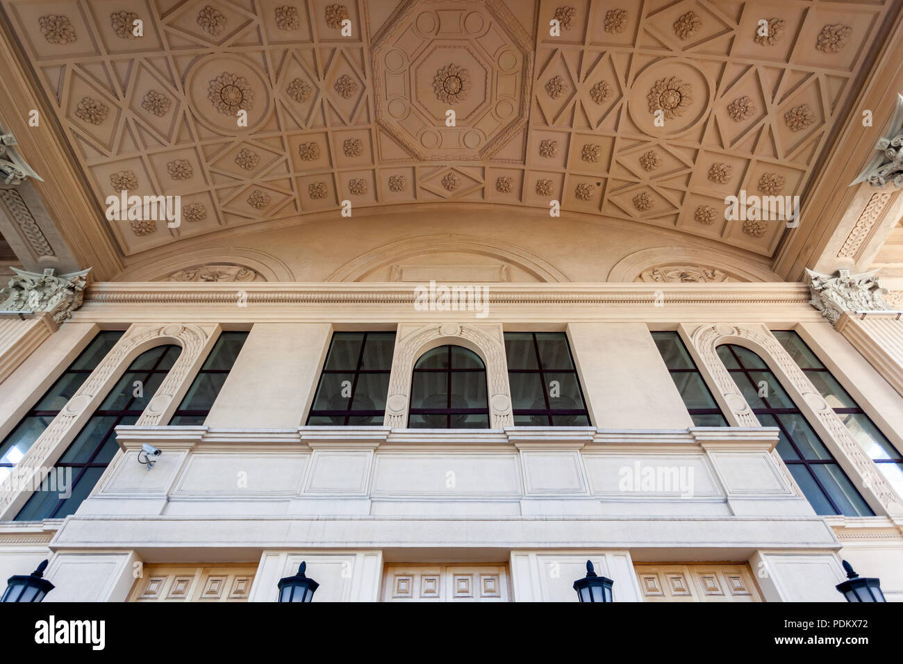 A close-up of the facade of an old Soviet building. The fresco on the ...