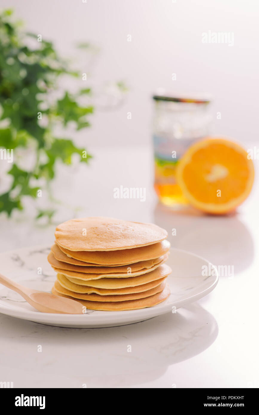Stack of delicious pancakes on plate isolated on white Stock Photo - Alamy