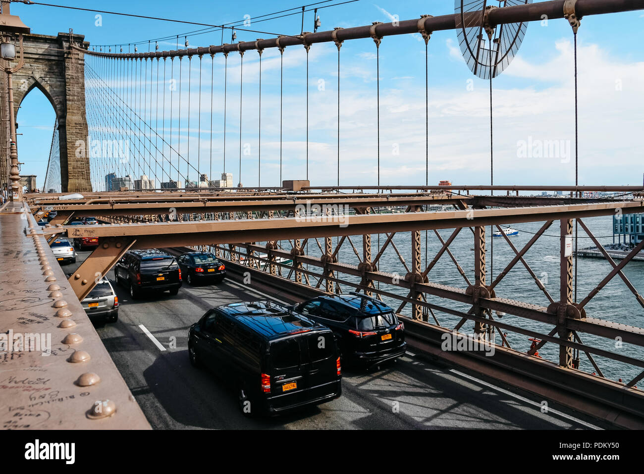 New York City, USA - June 20, 2018: Cars speeding on Brooklyn Bridge ...