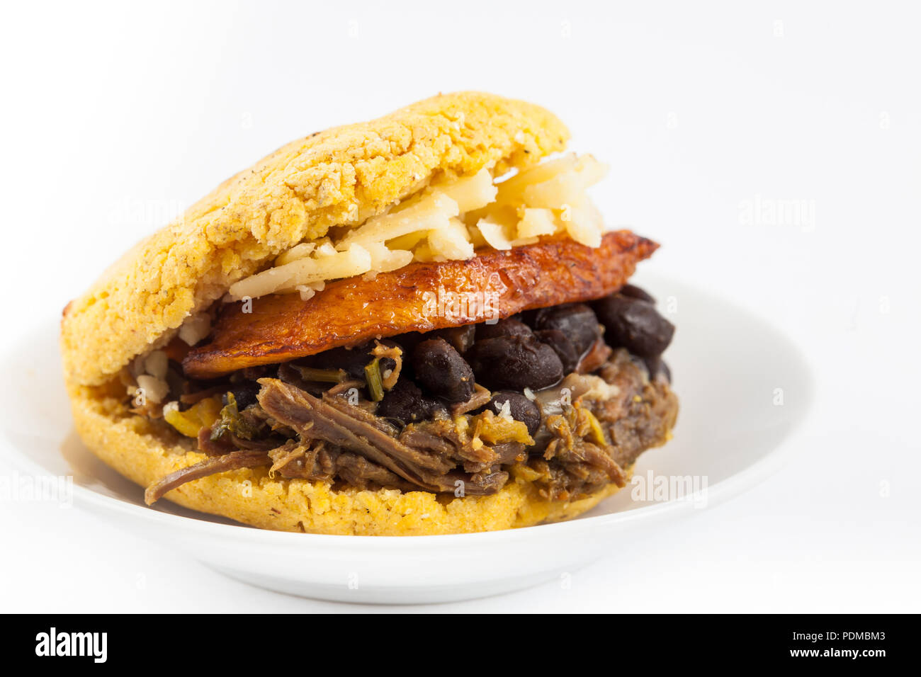 Arepas filled with shredded beef, black beans, plantain and cheese ...