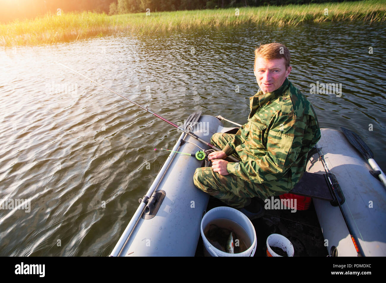 Fisherman catching big fish from boat hi-res stock photography and ...
