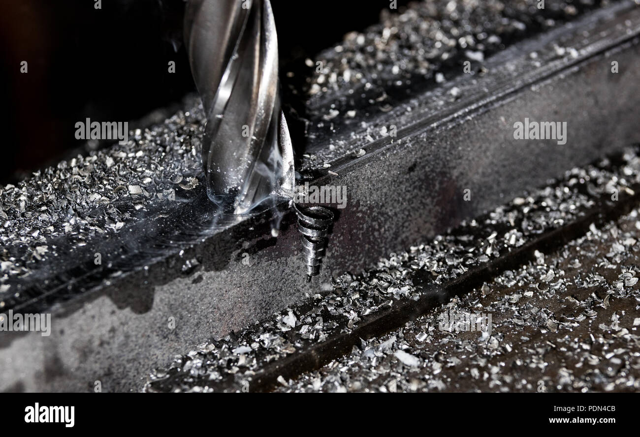 Bridgeport CNC end mill finishing a stack of steel plate with metal ...
