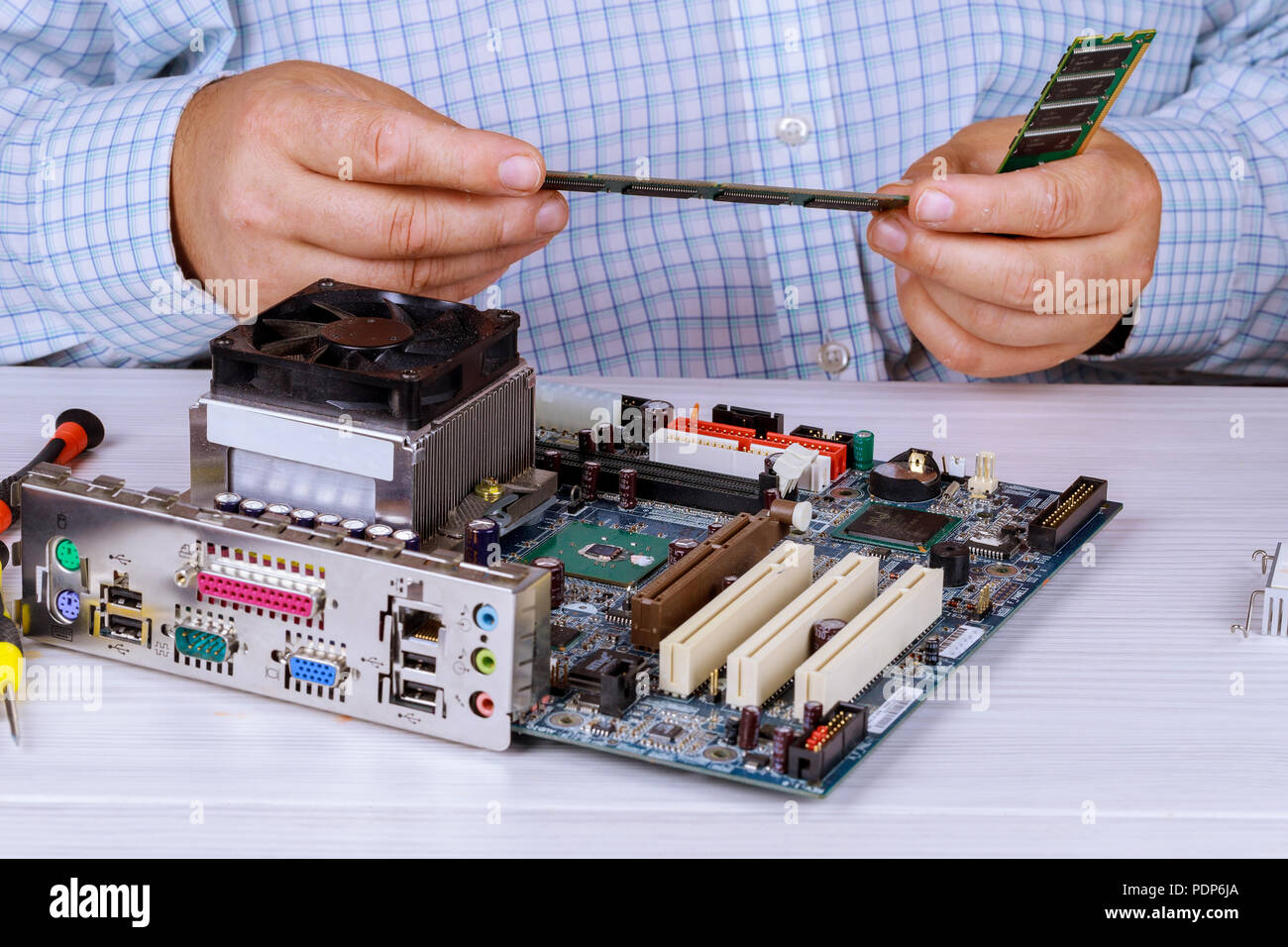 Installing random access memory into PC The concept of service electronics and computers Stock ...