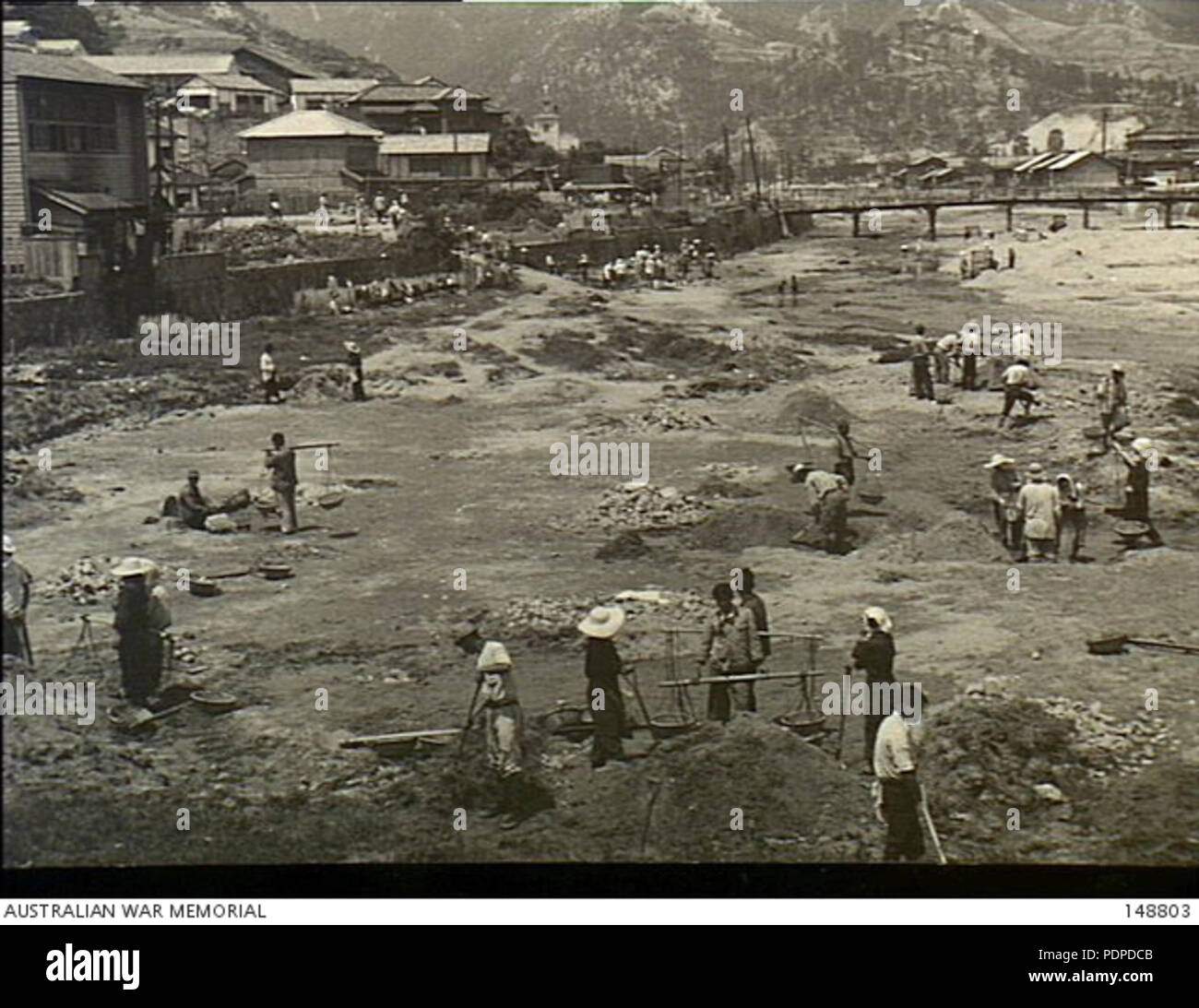 2 148803 Japanese cleaning out the sand and silt from the mouth of the ...
