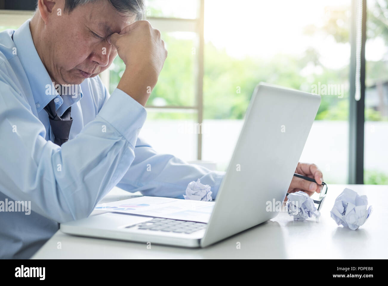 Depressed failure and tired businessman late sad and solving problem in ...