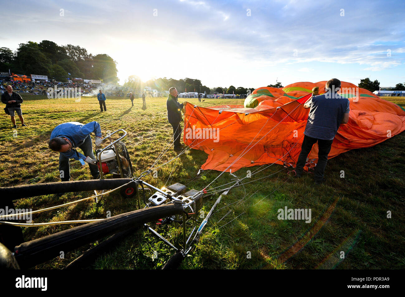Balloon crews inflate for a ground tether flight after bad weather ...