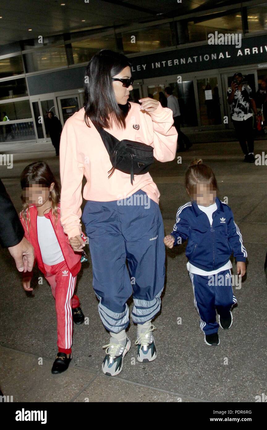 Kourtney Kardashian at Los Angeles International Airport (LAX) with her ...