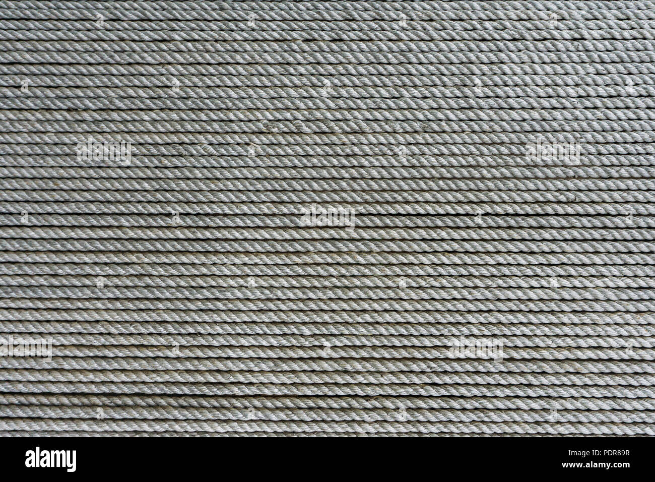 Gray background of aged ropes. Texture Stock Photo - Alamy