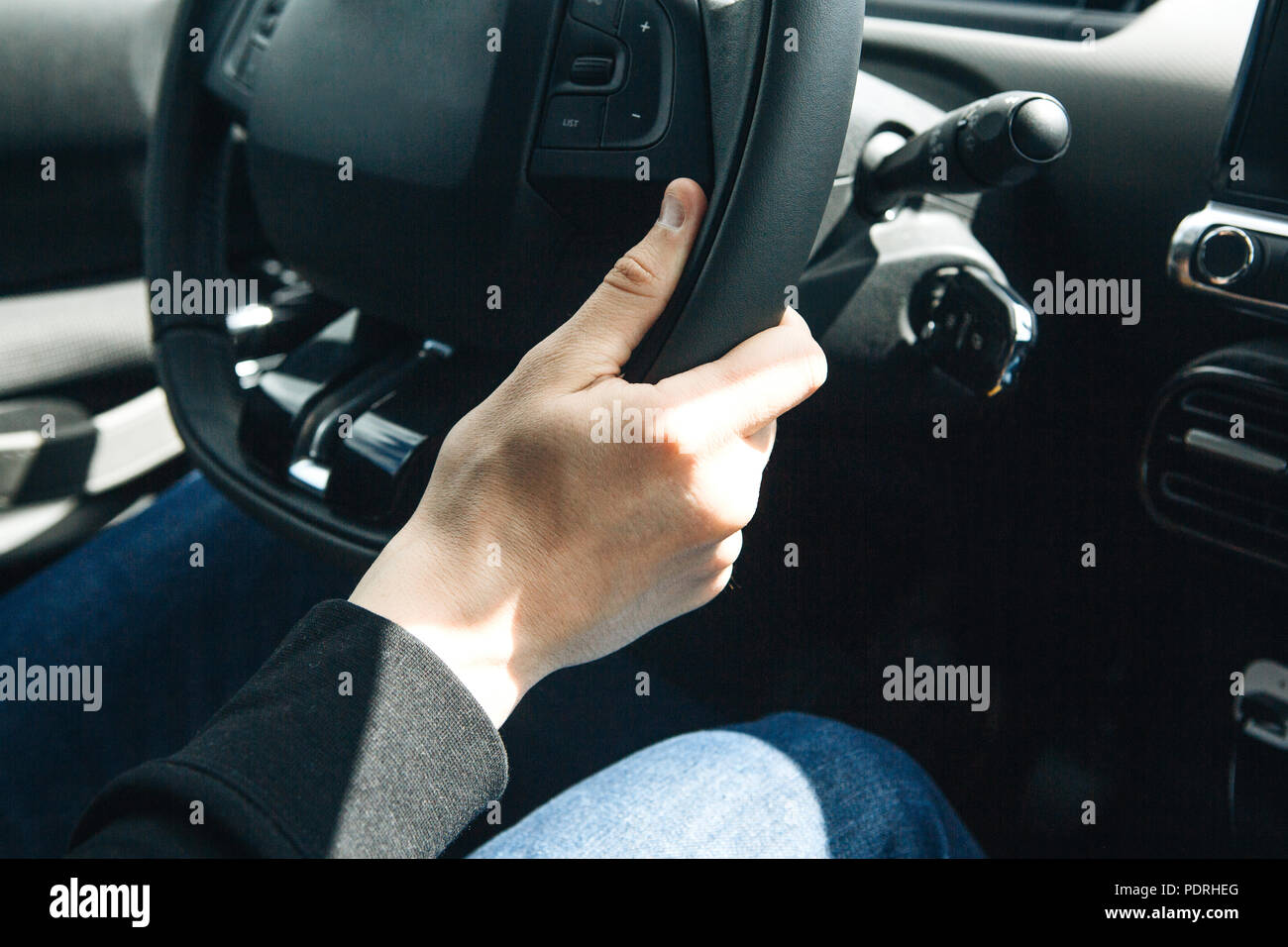 Drivers hand holding steering wheel hi-res stock photography and images ...