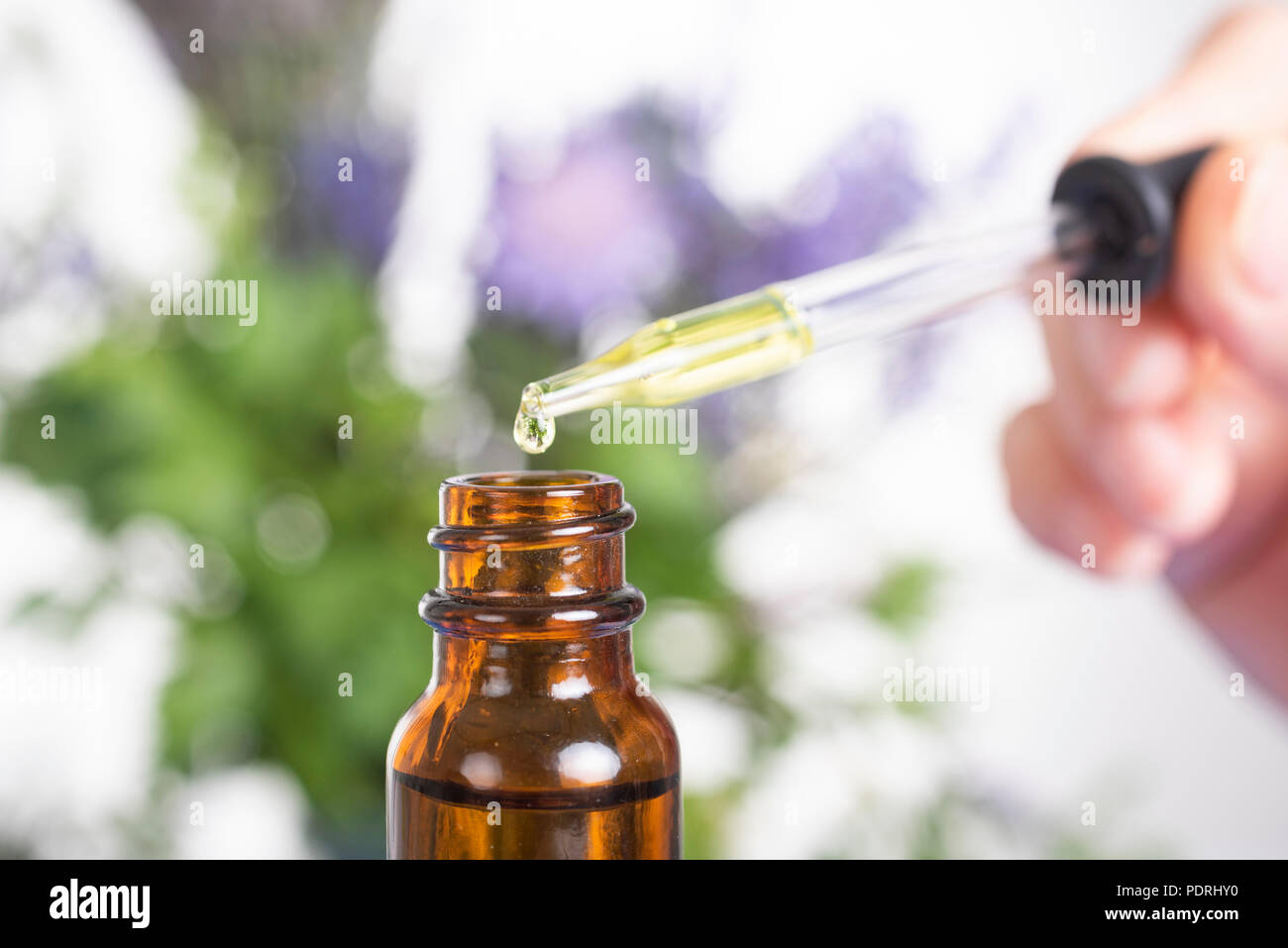 essential oils in front of white background Stock Photo - Alamy