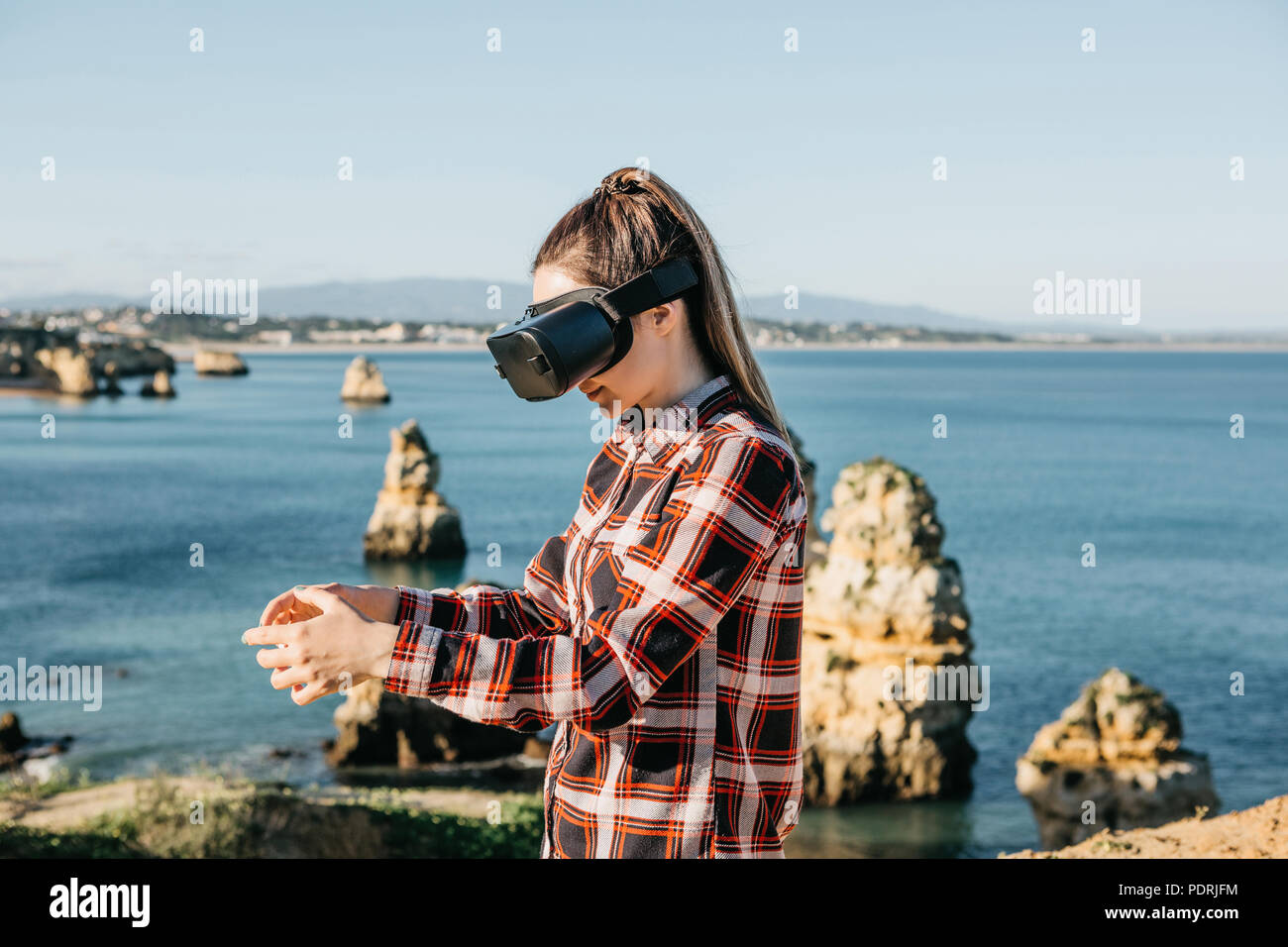 The girl in glasses of a virtual reality. Modern technology in everyday ...