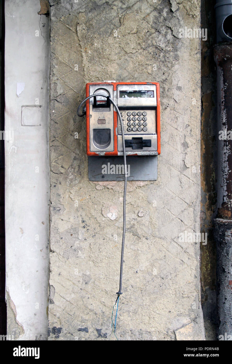 Lost connection - damaged old pay telephone Stock Photo - Alamy