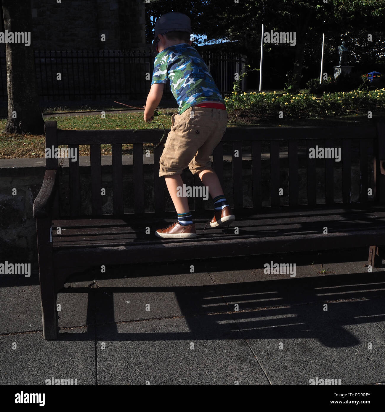 Young child playing on his own Stock Photo - Alamy