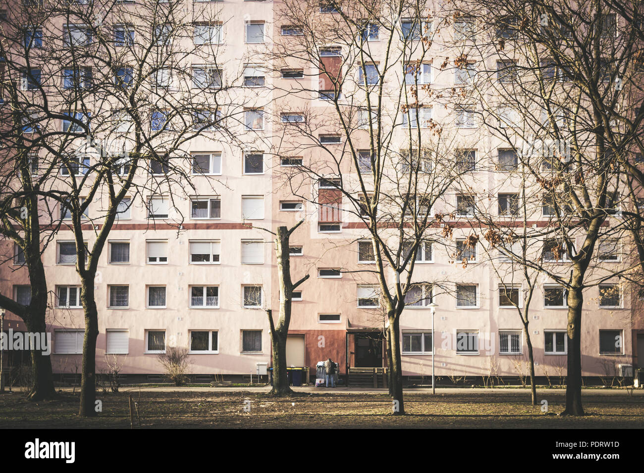 Front view of an old apartment building with a man during winter Stock ...