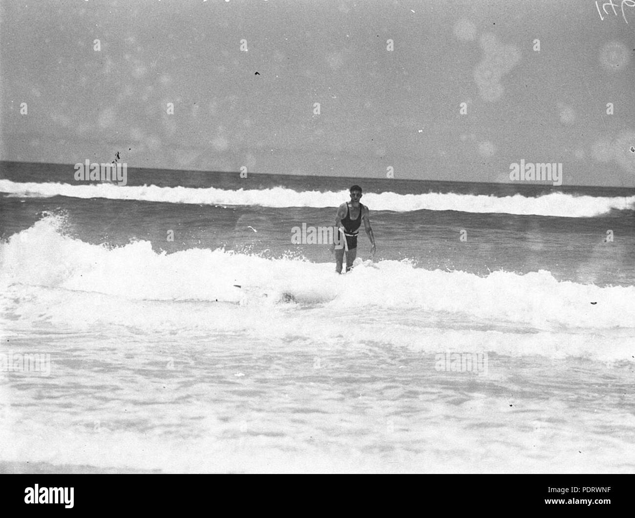 161 SLNSW 43432 Ronnie Anderson surfboard riding Bondi Beach Stock ...