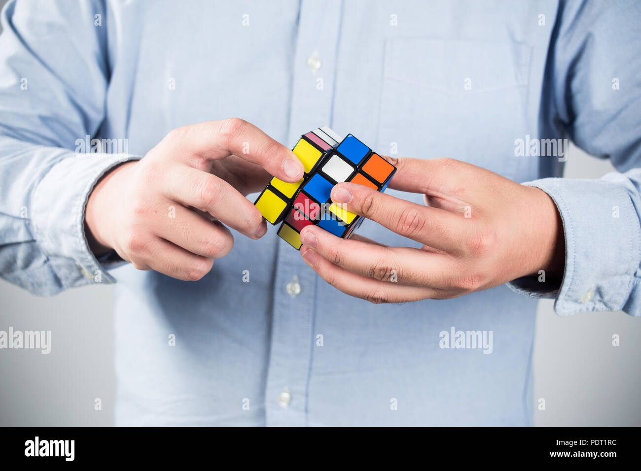Man holding rubiks cube hi-res stock photography and images - Alamy