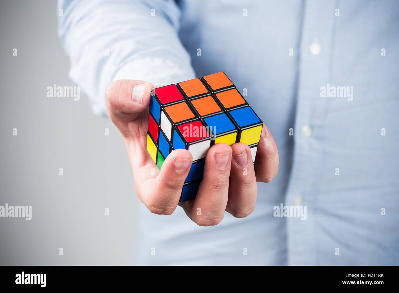 Man holding rubiks cube hi-res stock photography and images - Alamy