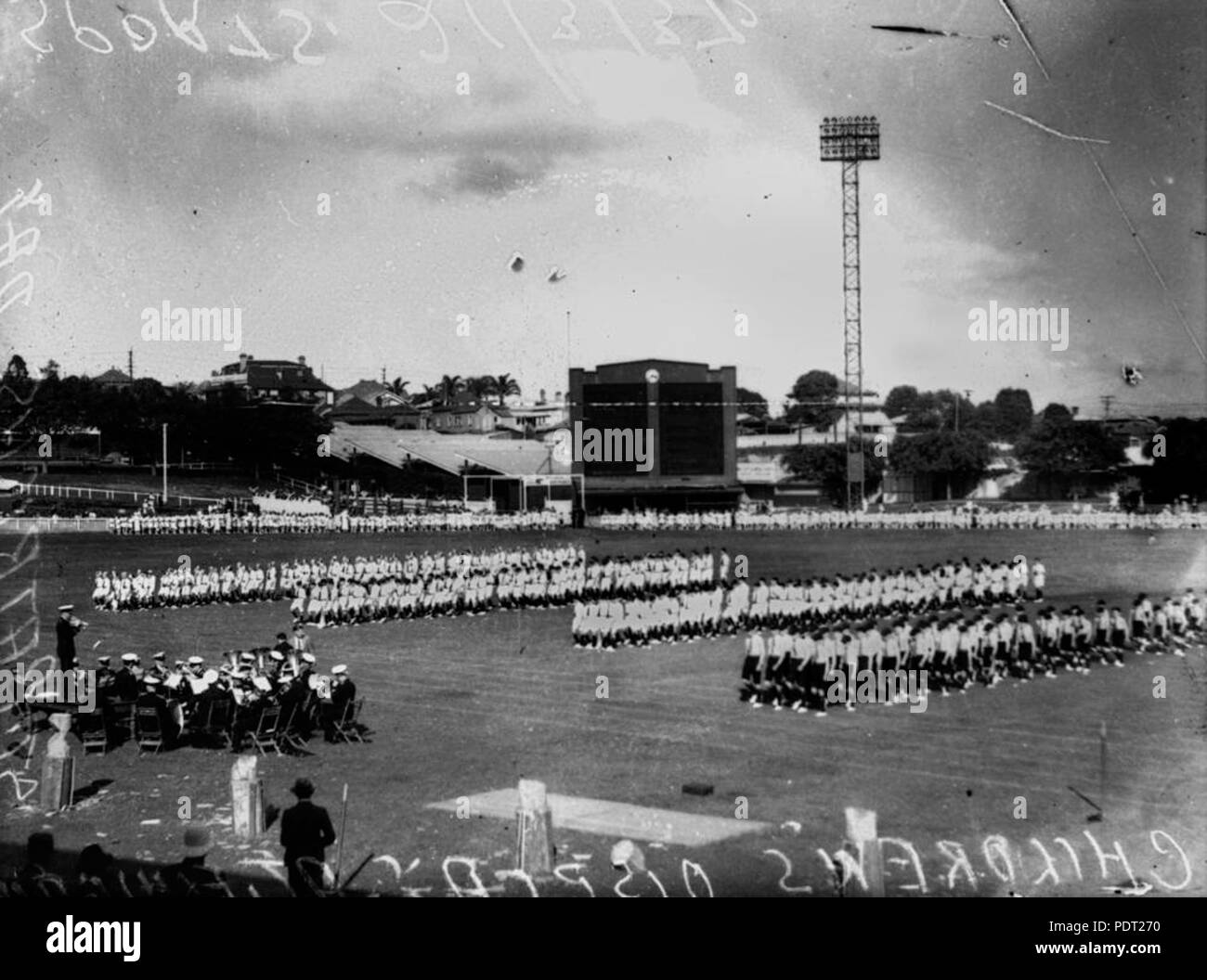 203 StateLibQld 1 106920 Children performing a marching display at the ...