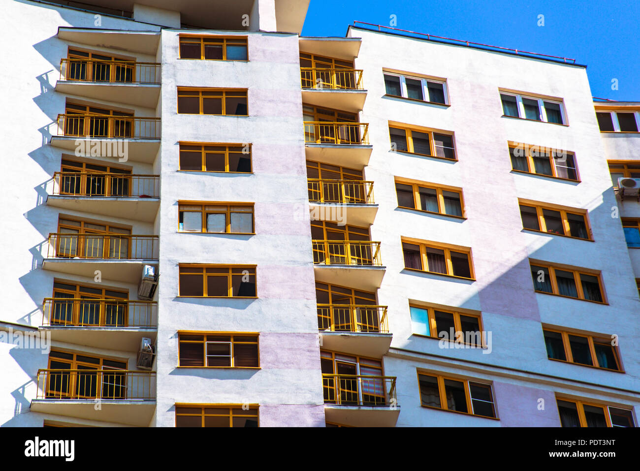 Modern apartments facade texture in sun light Stock Photo - Alamy