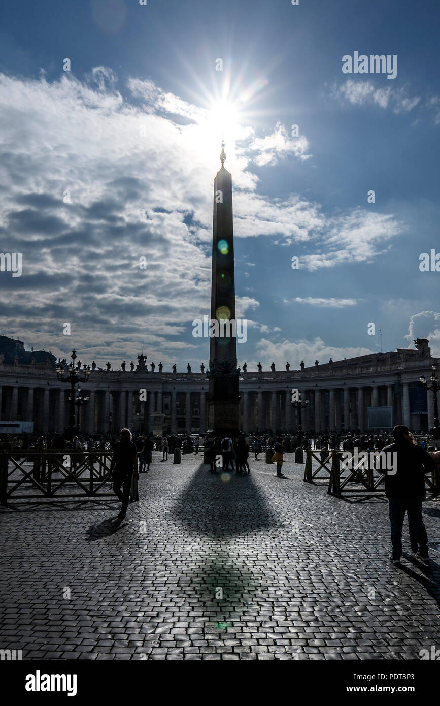The sun is at the top over the Saint Peter's Square in the Vatican City ...
