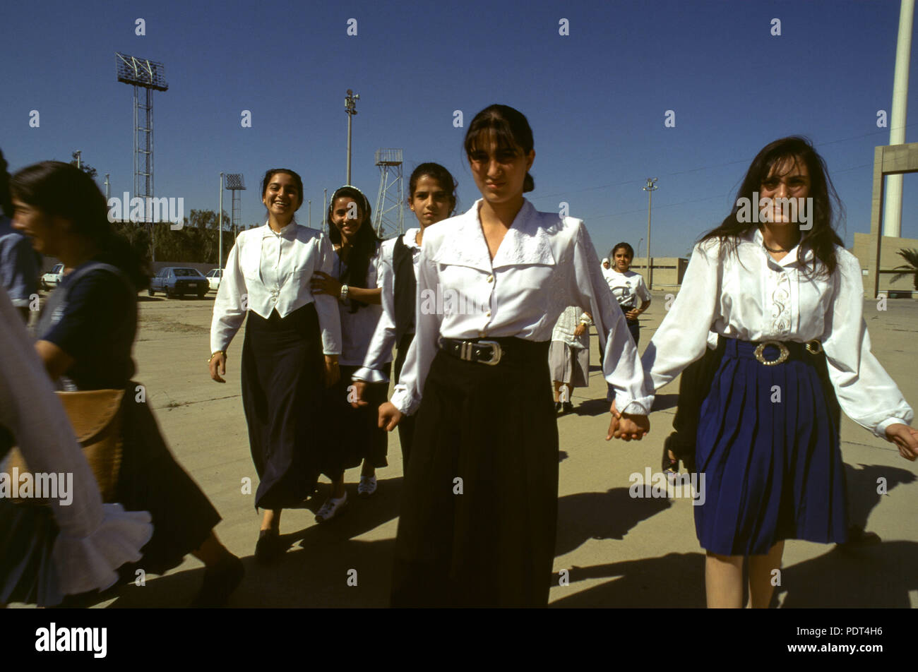 Iraqi high school girls hold a rally and march for national unity and ...