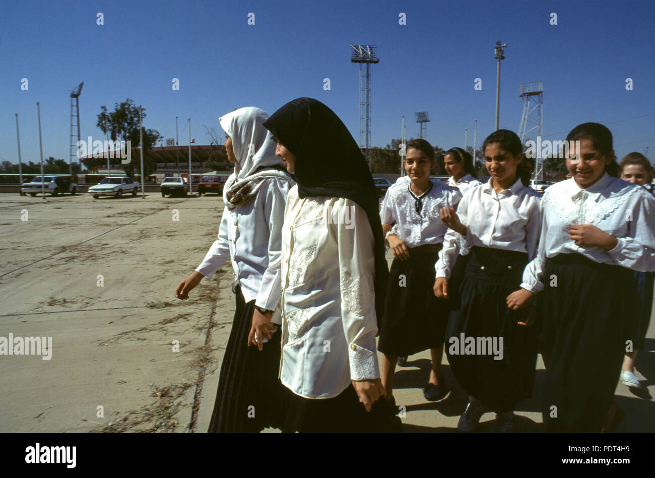 Iraqi high school girls hold a rally and march for national unity and ...