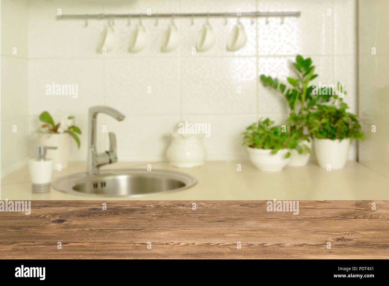 Wooden worktop on blur background Stock Photo - Alamy