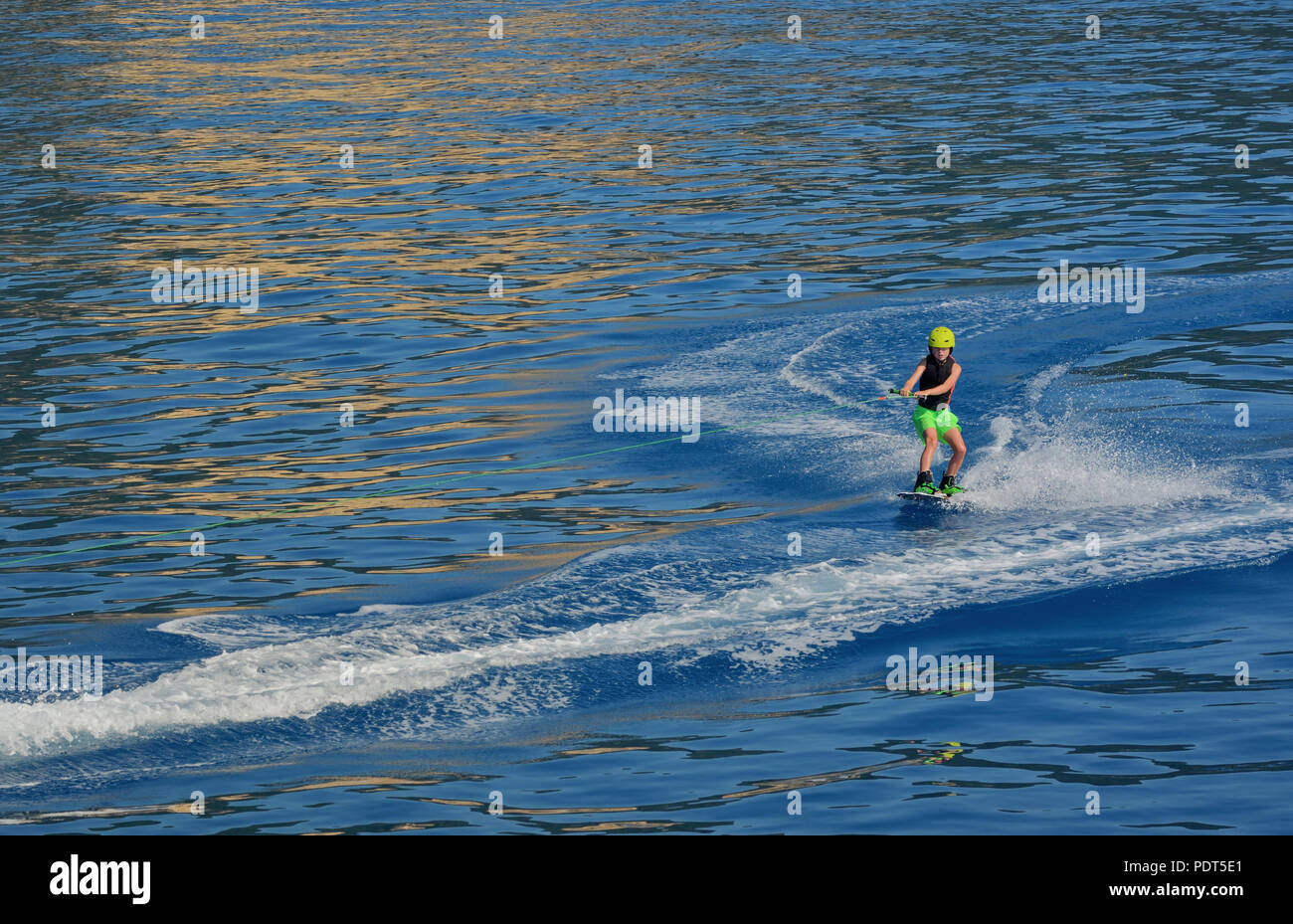 Little boy Wakeboarding on summer sea Stock Photo - Alamy