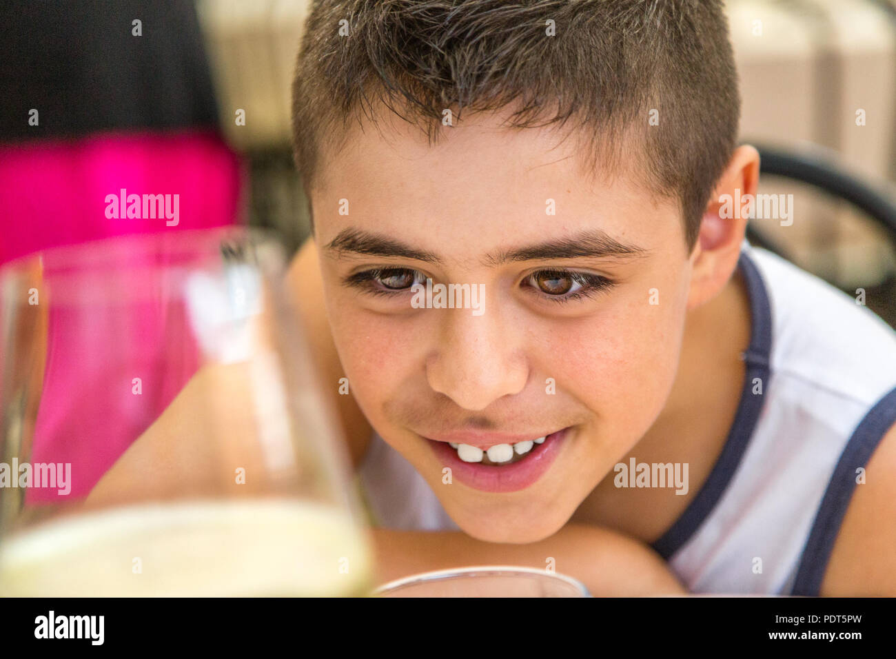 smiling boy looking at something intriguing him Stock Photo - Alamy