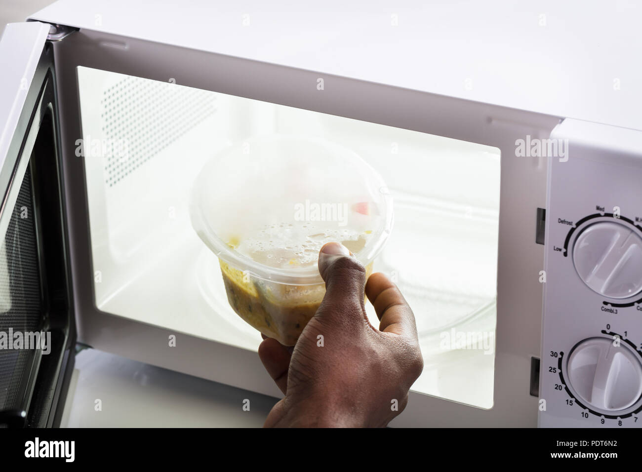 Microwave food male hi-res stock photography and images - Alamy