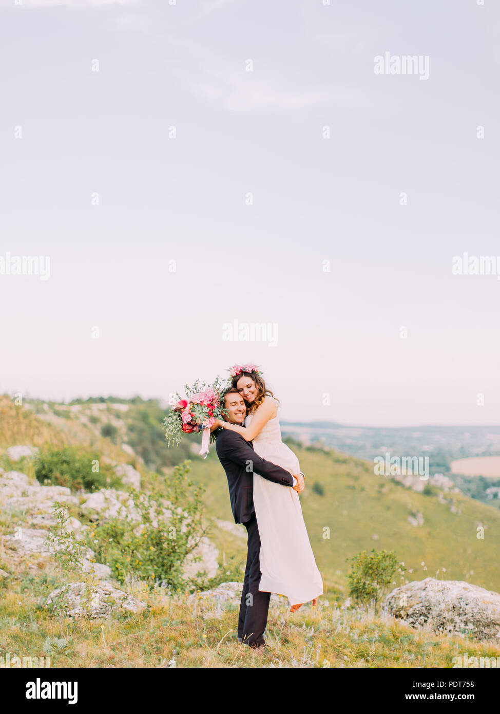 Newly married couple groom carrying hi-res stock photography and images ...