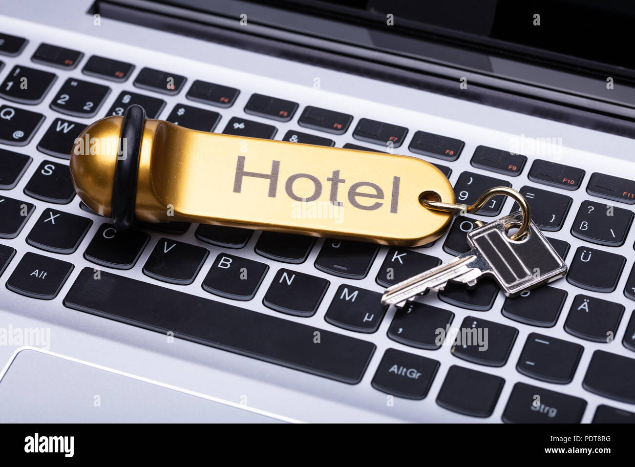 Elevated View Of Hotel Key On Laptop Keypad Stock Photo - Alamy