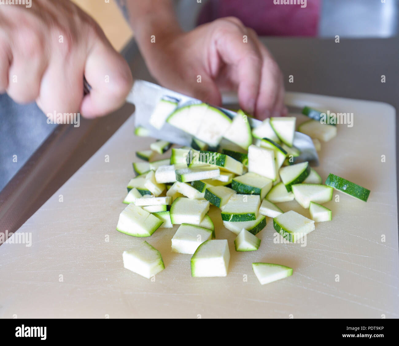 Close up man chopping courgette hi-res stock photography and images - Alamy