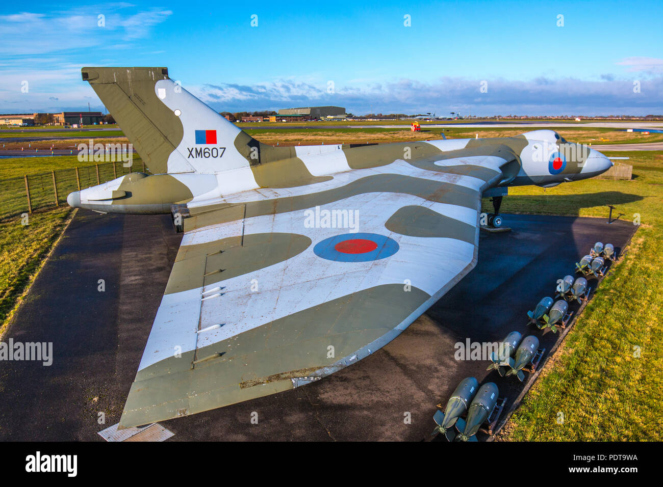 Vulcan XM607 sits with a cluster of bombs on a site at RAF Waddington ...