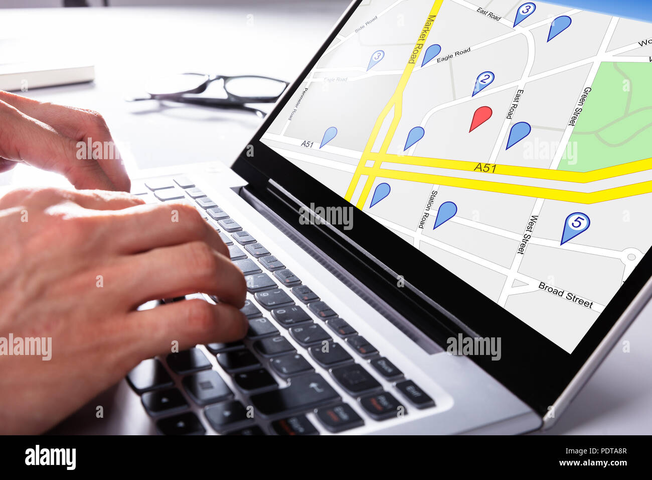 A Person Using Gps Map With Navigation Pointer On Laptop Stock Photo ...
