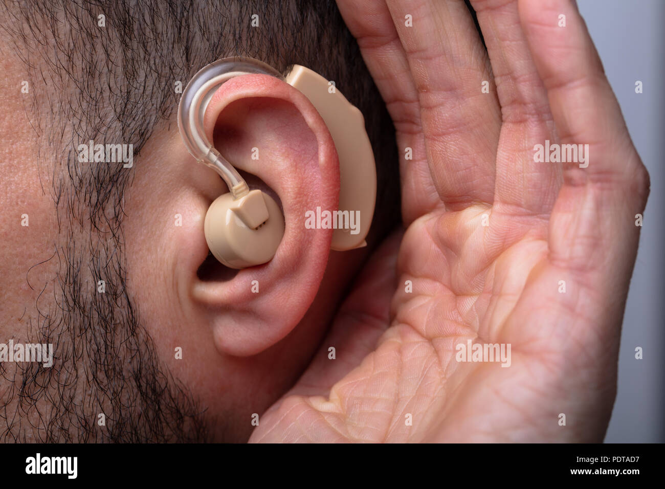 Mans hand holding ear hi-res stock photography and images - Alamy