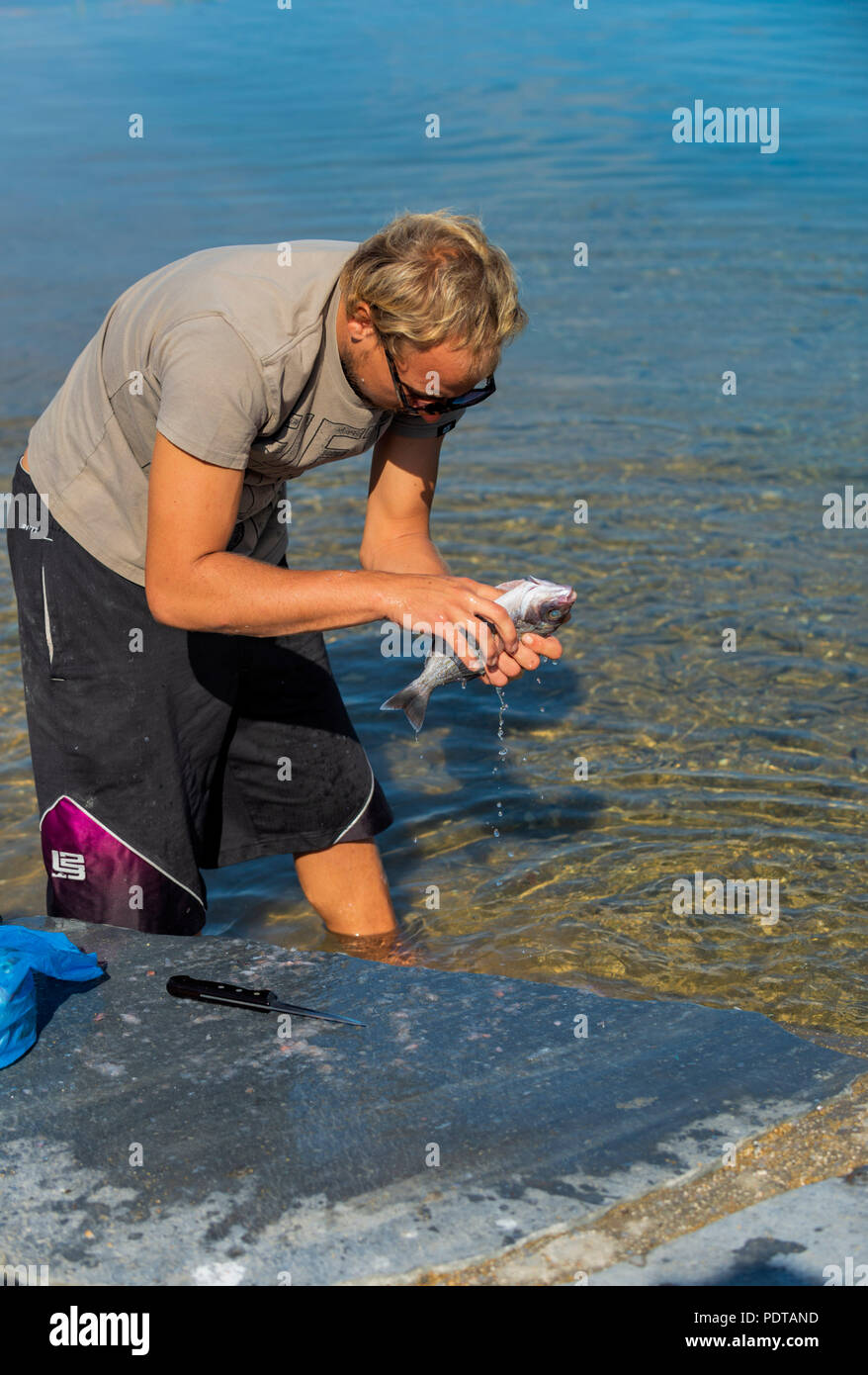 Cleaning fish hi-res stock photography and images - Alamy