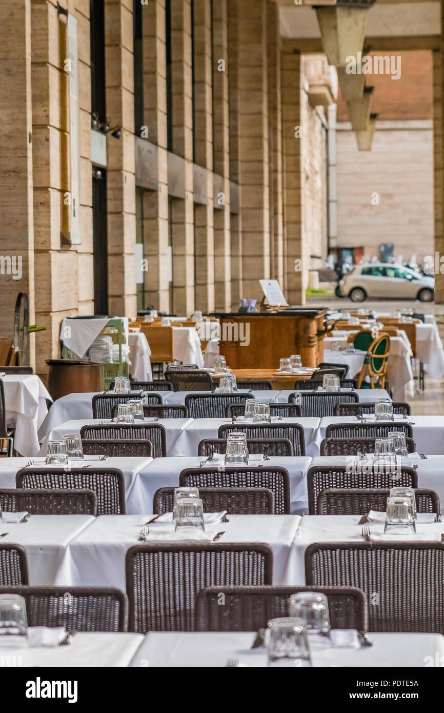 Tables set at an open air street cafe in Rome, Italy Stock Photo - Alamy