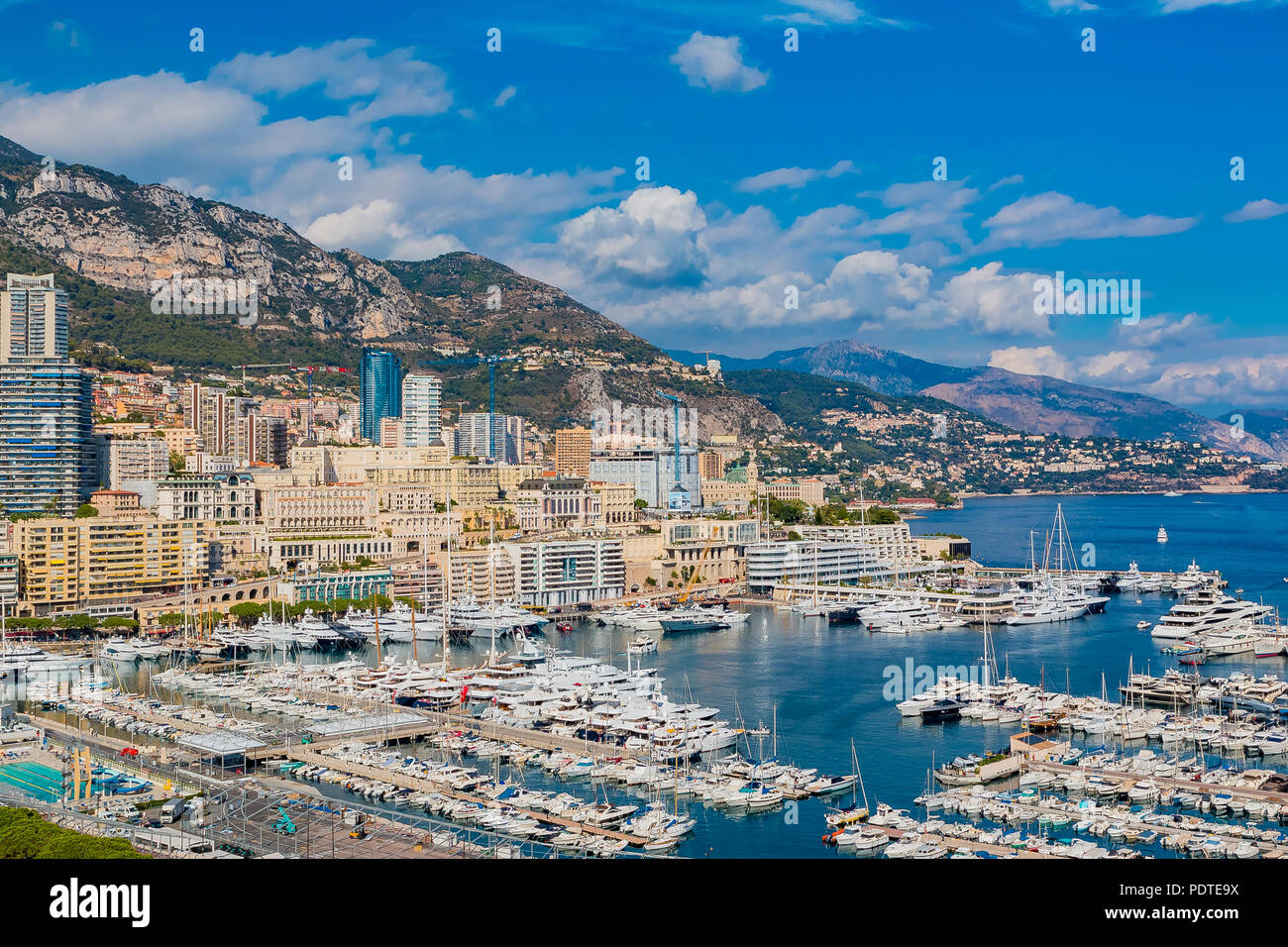 Monte Carlo city marina. View of luxury yachts and apartments in harbor ...