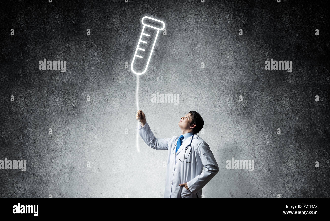 Doctor and vial symbol Stock Photo - Alamy