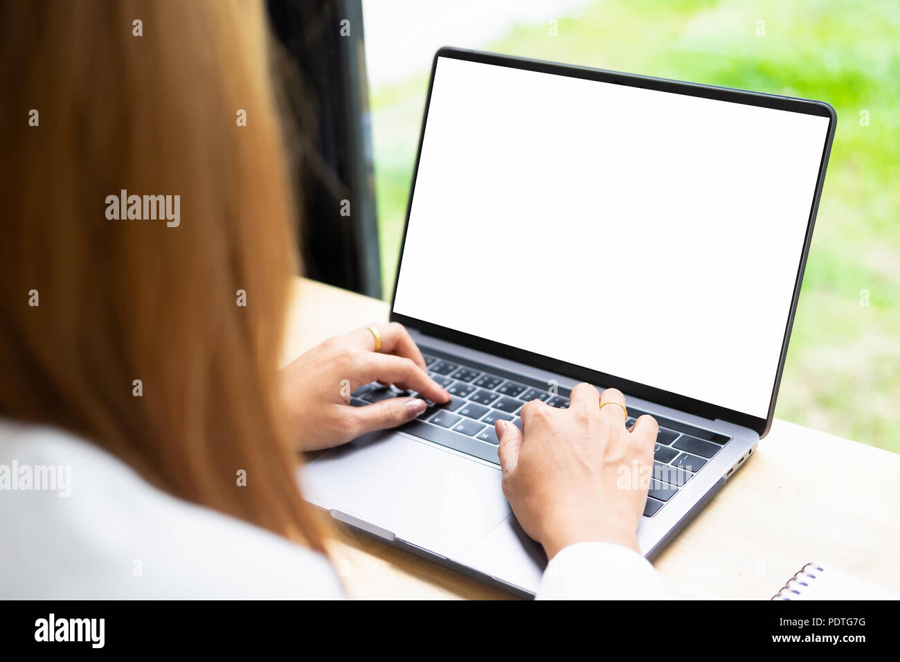 Woman using mockup laptop computer with white screen display Stock ...