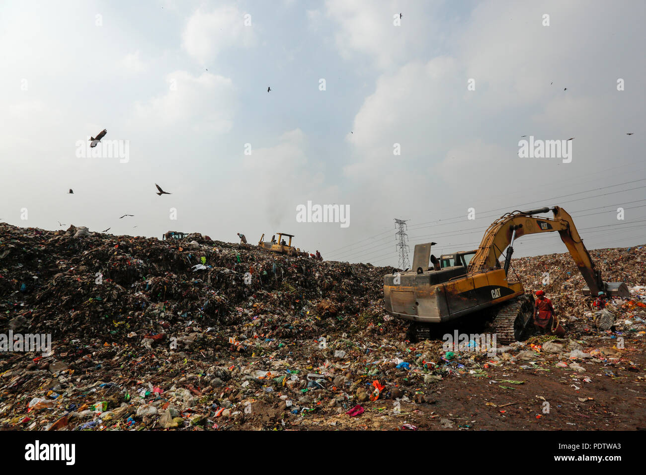 Matuail garbage dump yard in Dhaka, Bangladesh. It received 1500 tones ...