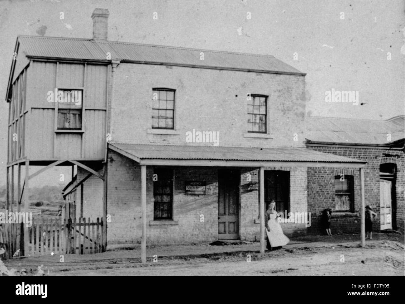 216 StateLibQld 1 129971 Matilda Elizabeth Roberts outside her home in ...