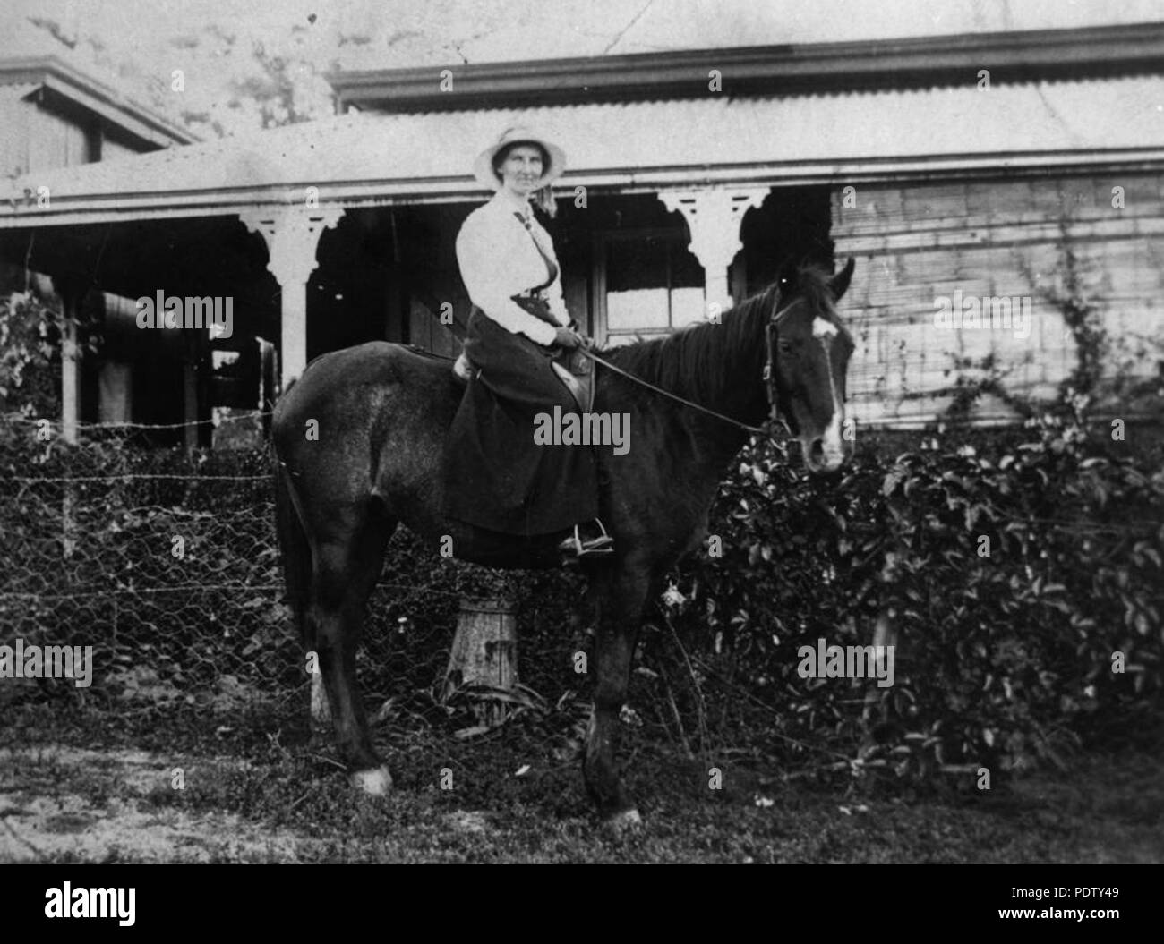 217 StateLibQld 1 130915 Susan Strain on horseback outside the Dayboro ...