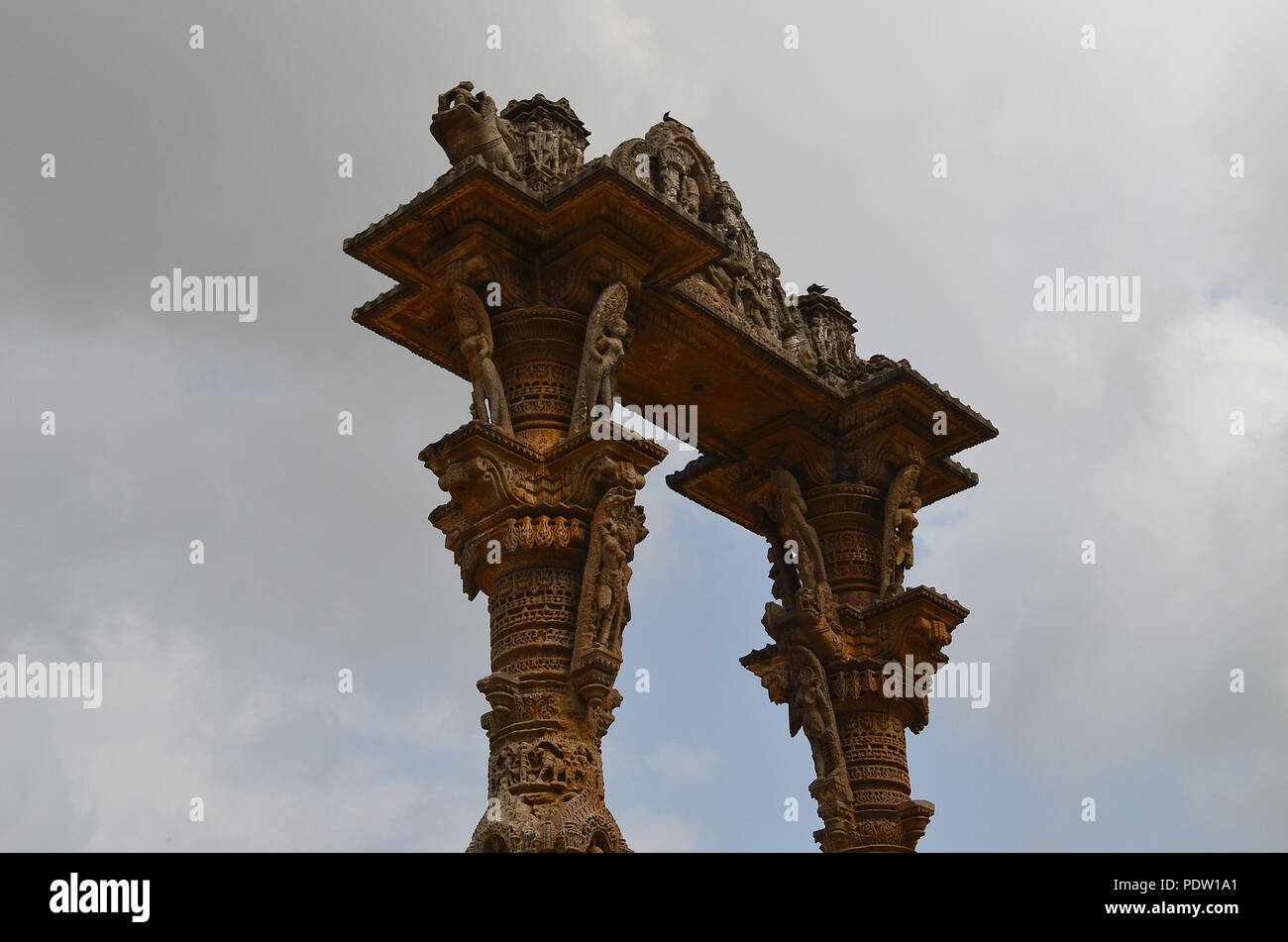 Carved old hindu temple arched gate in india Stock Photo - Alamy