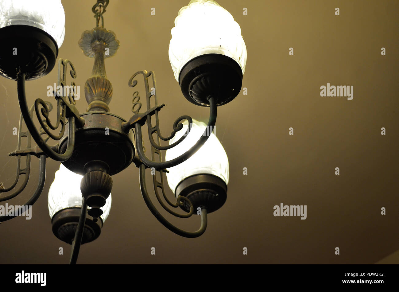 Old vintage rusted bronze metal chandelier lamp Stock Photo - Alamy