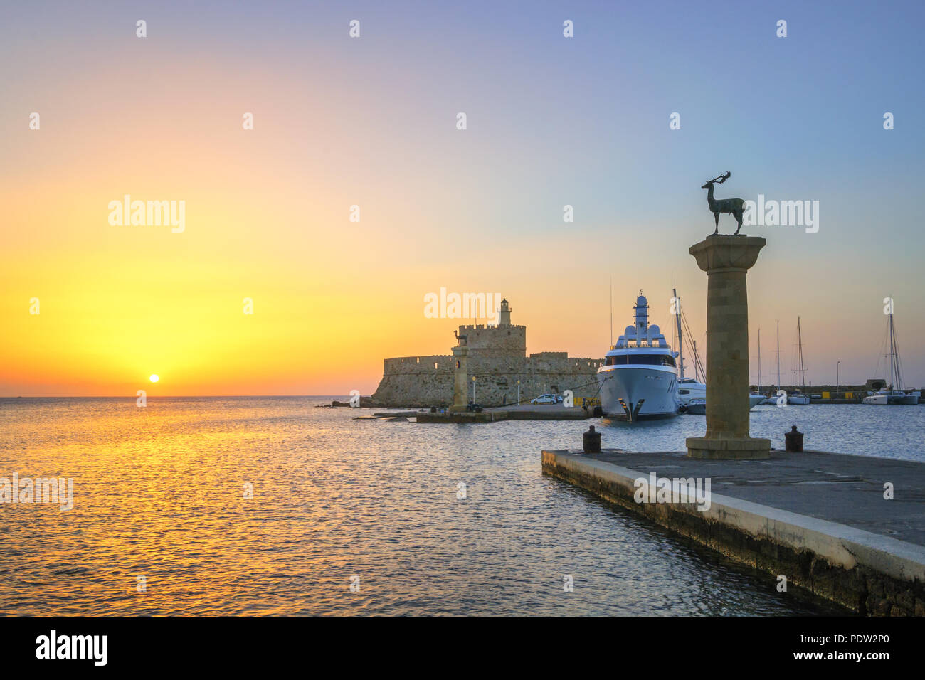 Entrance to Port of Rhodes at first sunlight - Greece Stock Photo - Alamy