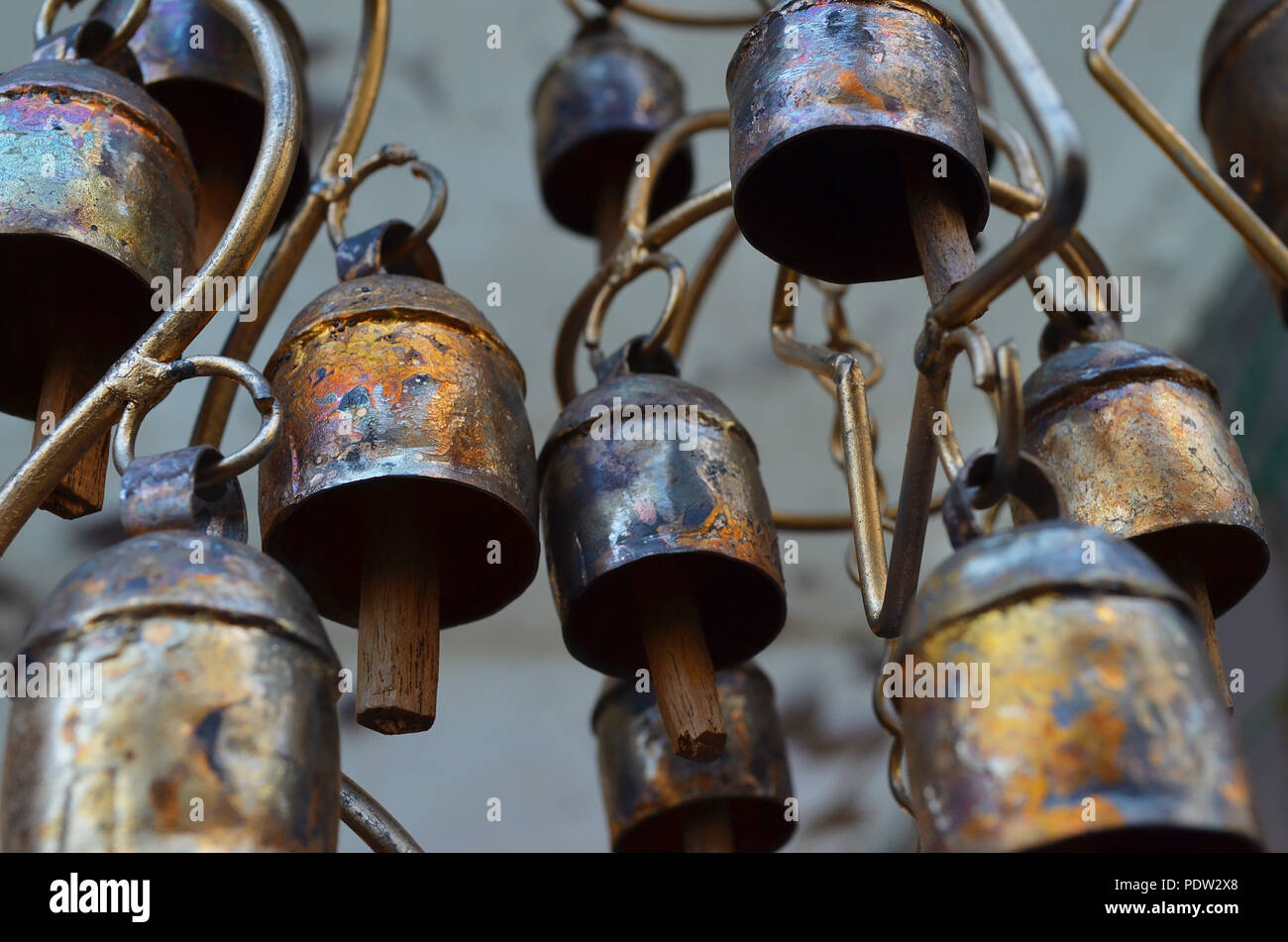 old rusty tribal metal bells for feng shui Stock Photo - Alamy